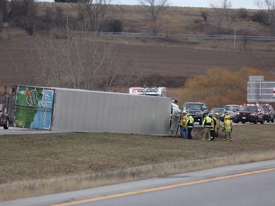 Windstorm topples trucks, downs trees and leaves thousands without power