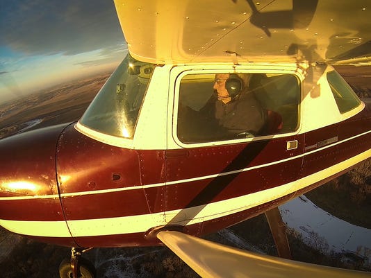 The world's oldest pilot, an Iowan, takes flight on his 99th birthday