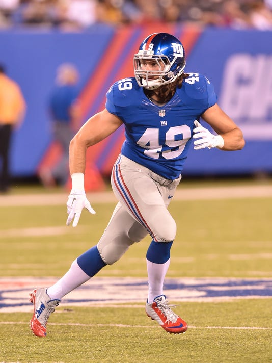 Former Giants player rescues man from burning roof