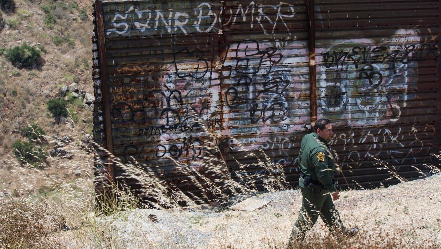 A human smuggler, and the wall that will make him rich