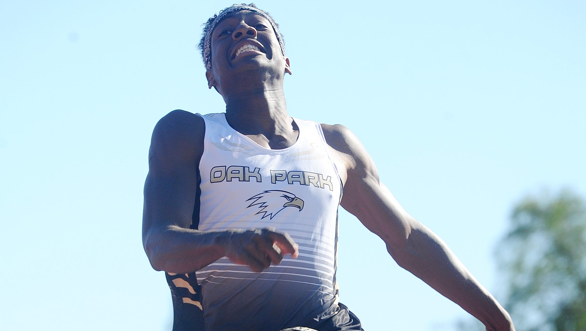 Oak Park's Reece Smith leaps ahead of the competition