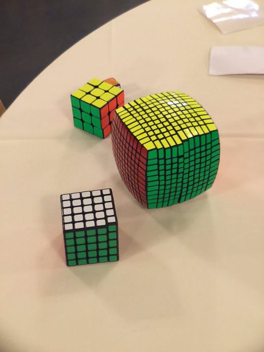 Fast hands on display at Rubik's Cube tournament