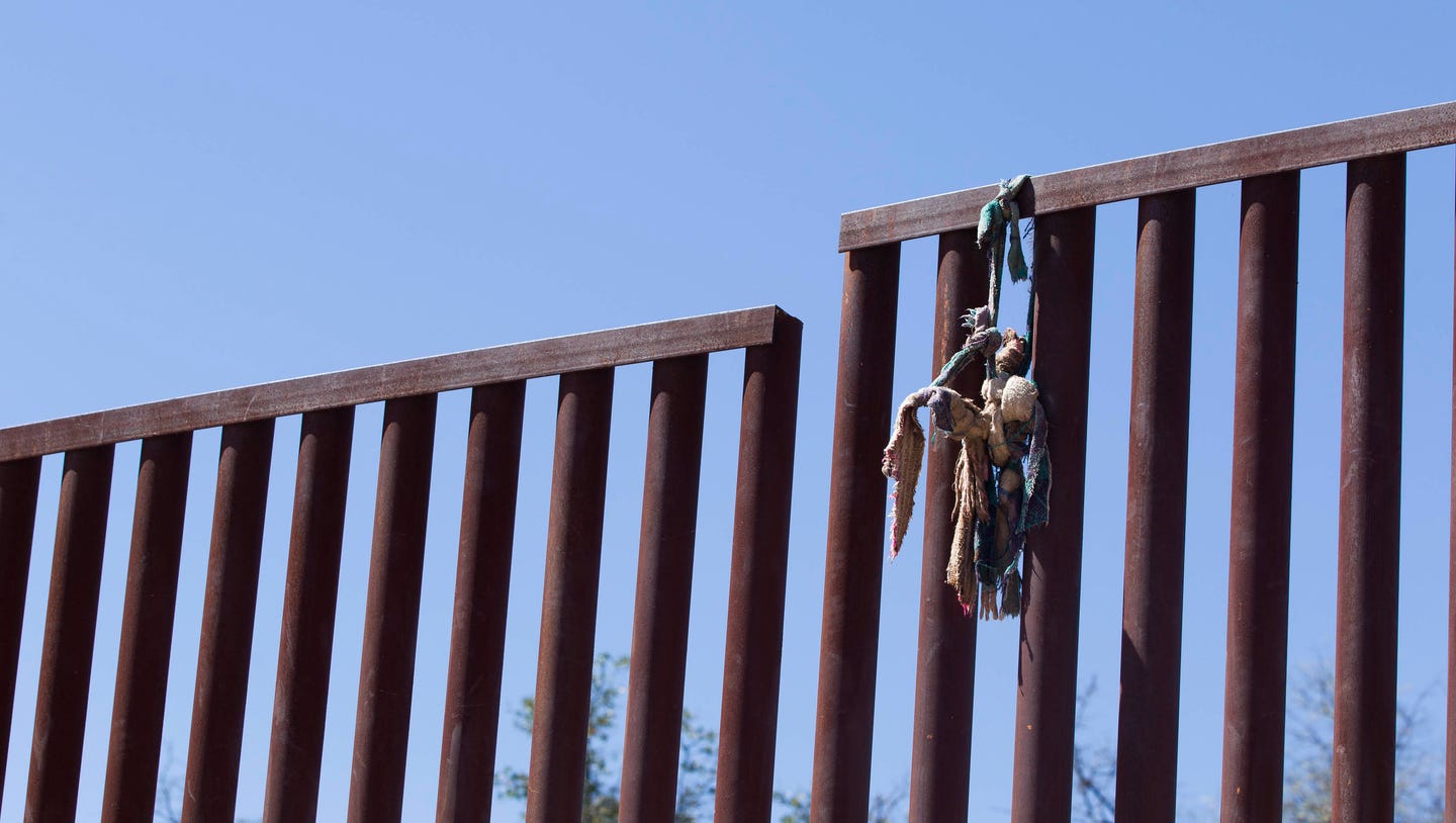 A human smuggler, and the wall that will make him rich