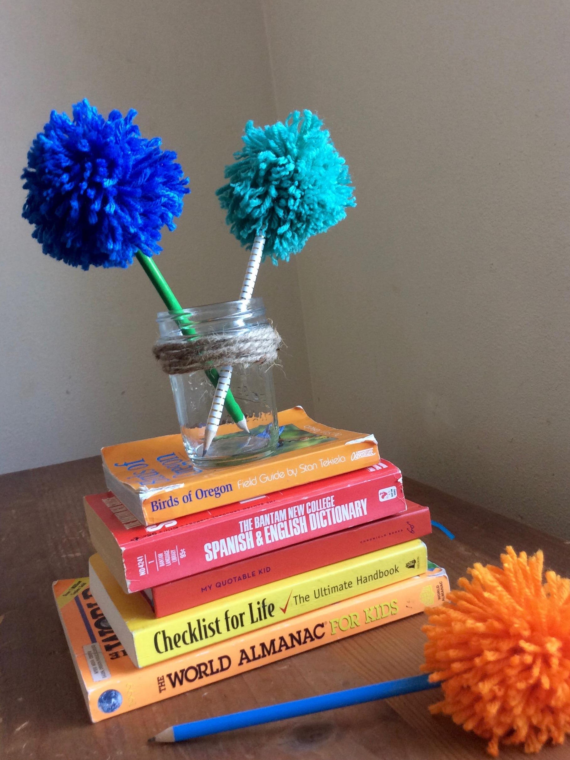 Add a poof of color to your work or craft space with these yarn poof ...
