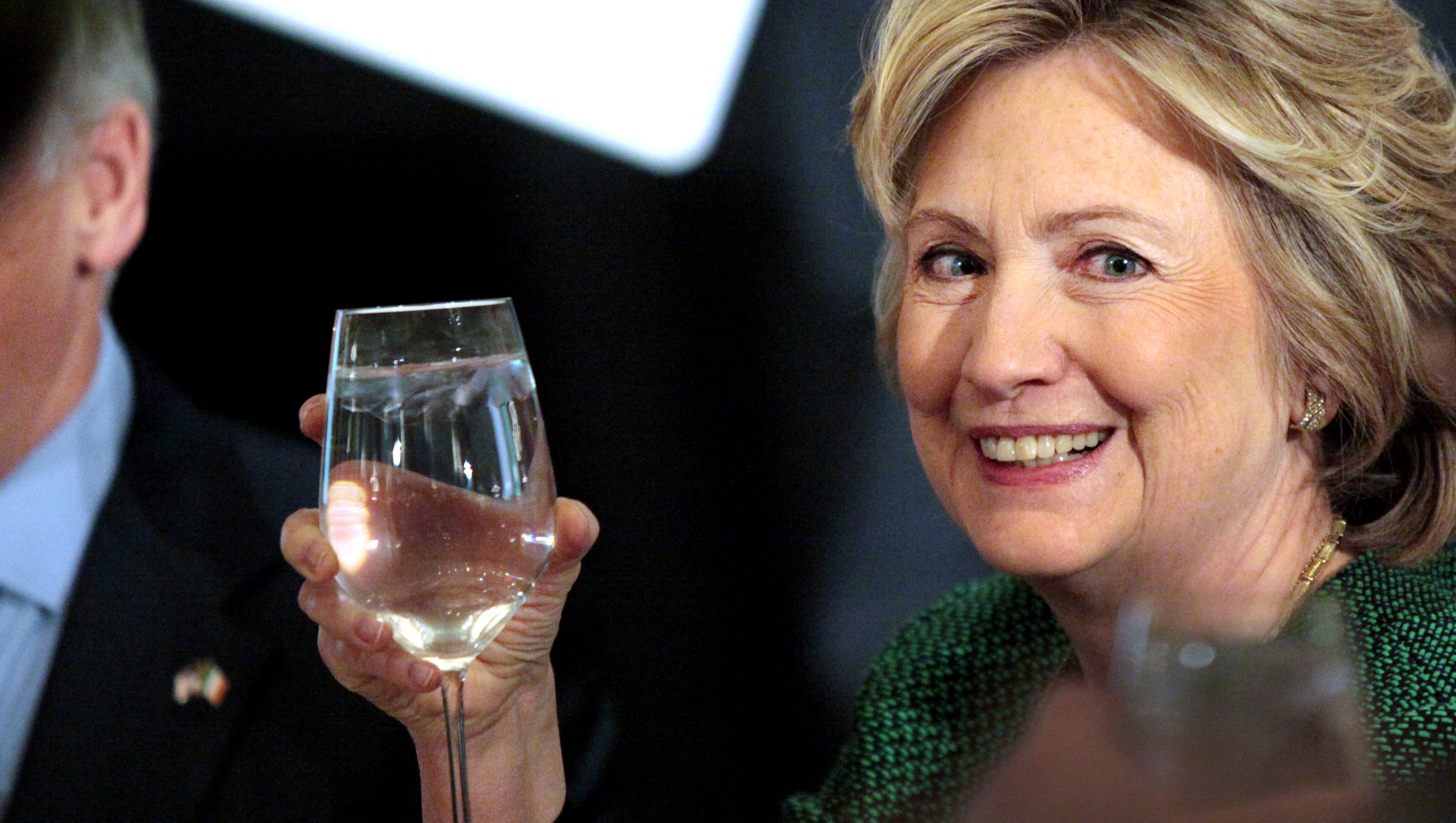 Hillary Clinton raises her glass during a toast at a ceremony to induct ...