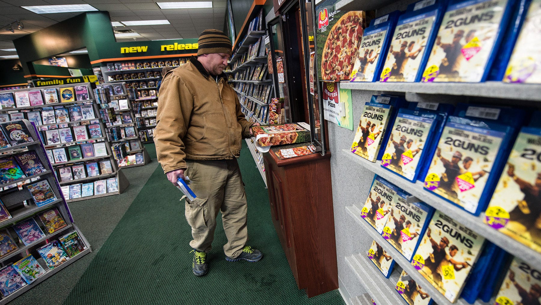 Movie chain adds pizza to fight streaming wave