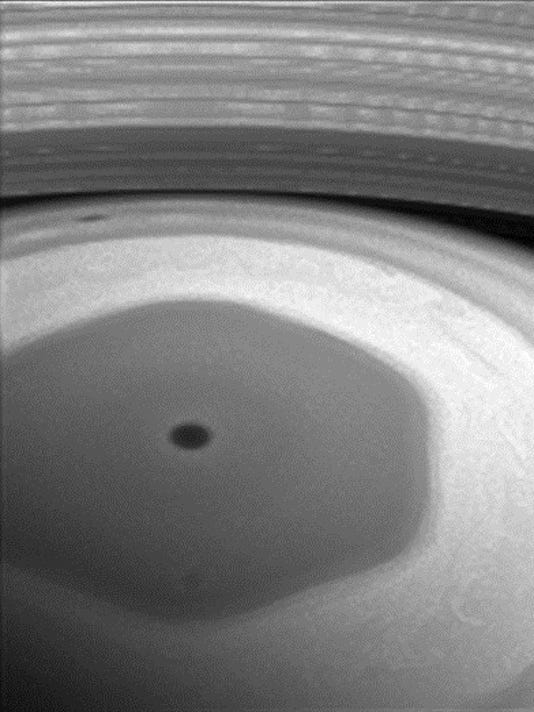 Saturn's hexagon-shaped storm stuns in new close-up images