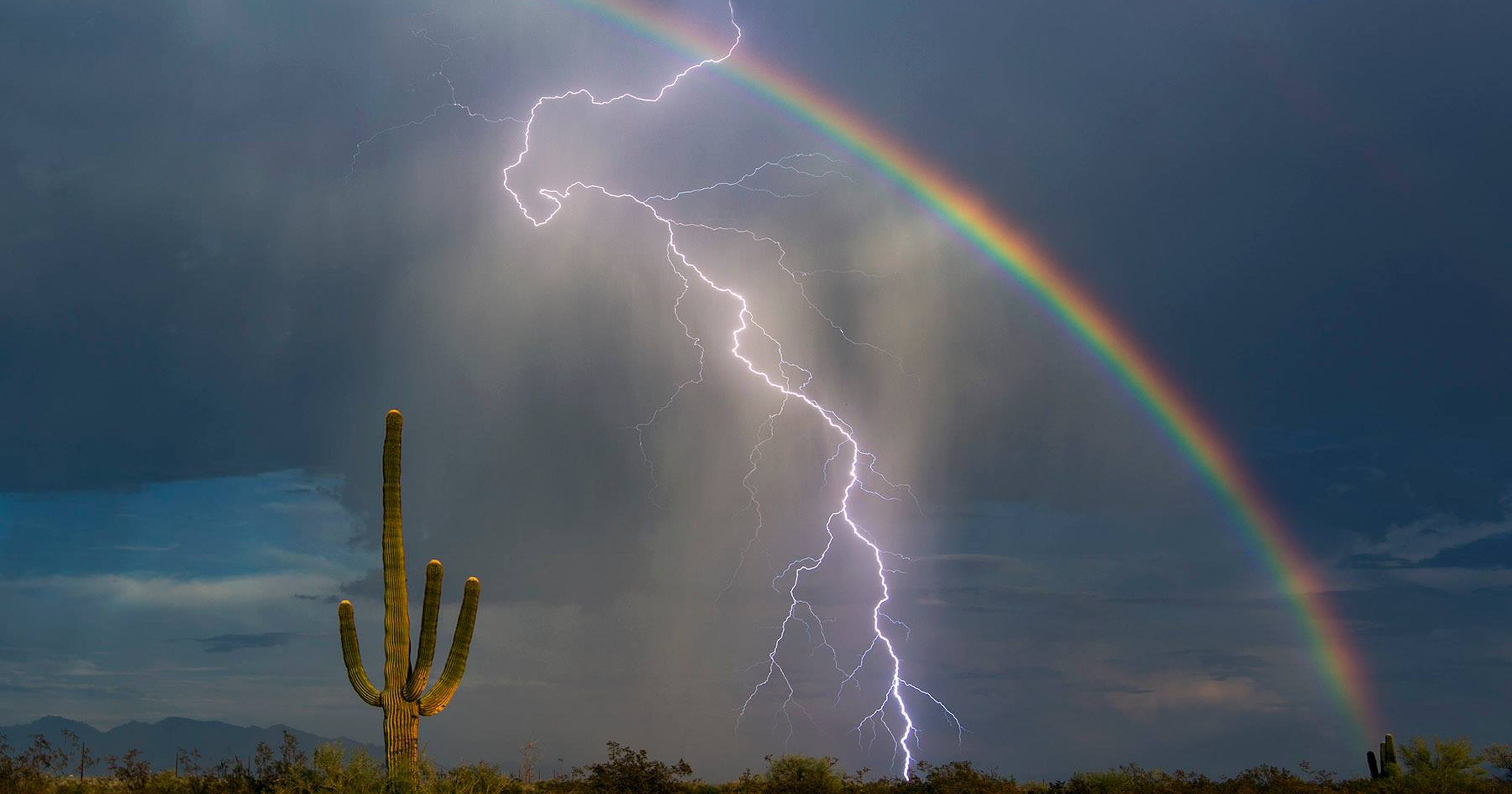 Lightning strike, rainbow caught in one photo