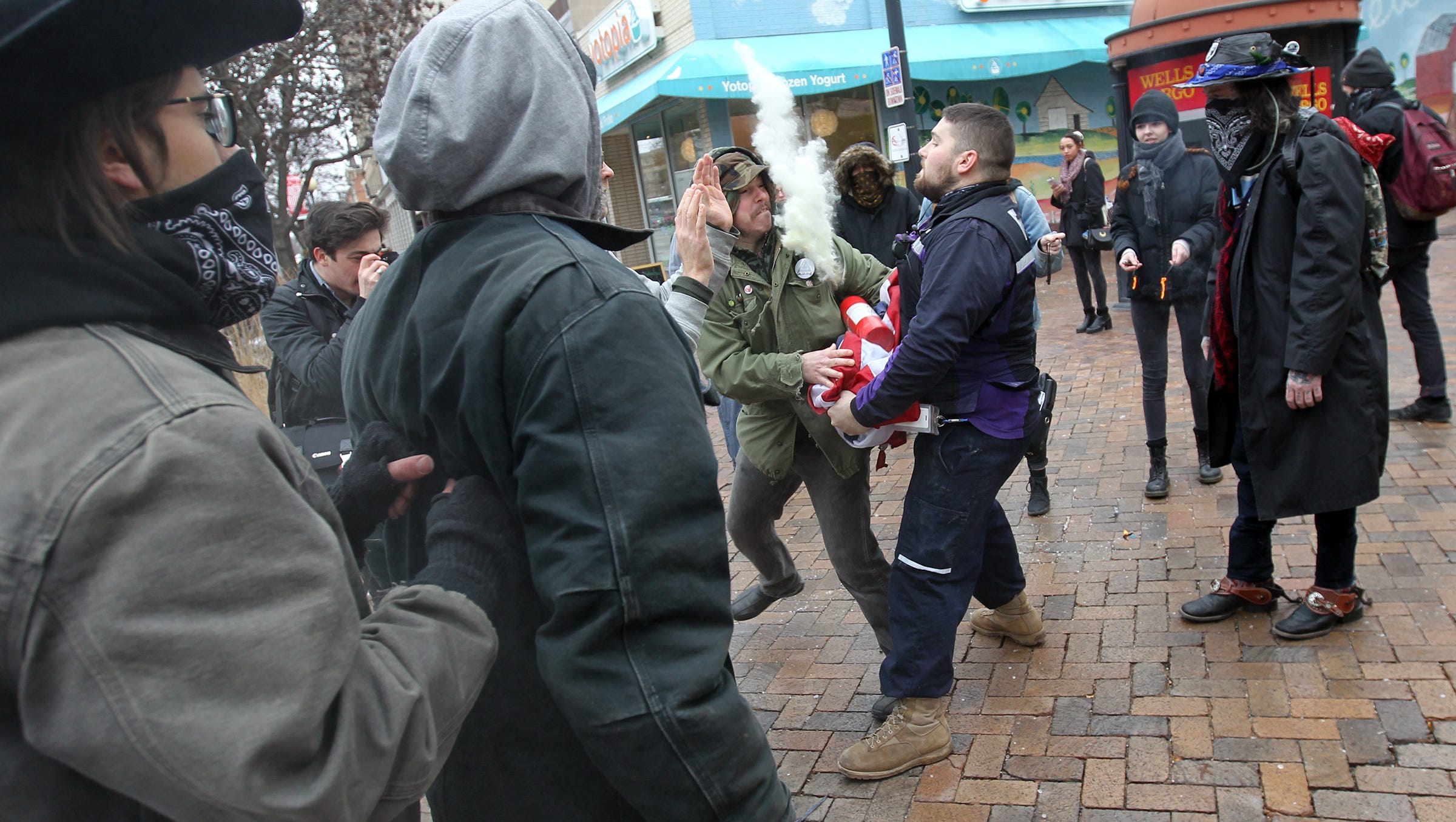 Flag burning protest sets off clash in ped mall