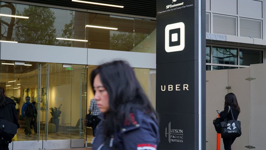 Uber to pay up to $100M in driver status suits
