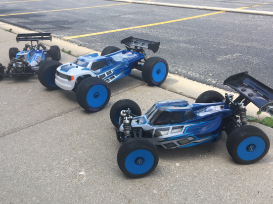 Having a blast by remote control, racers take on track's jumps and turns