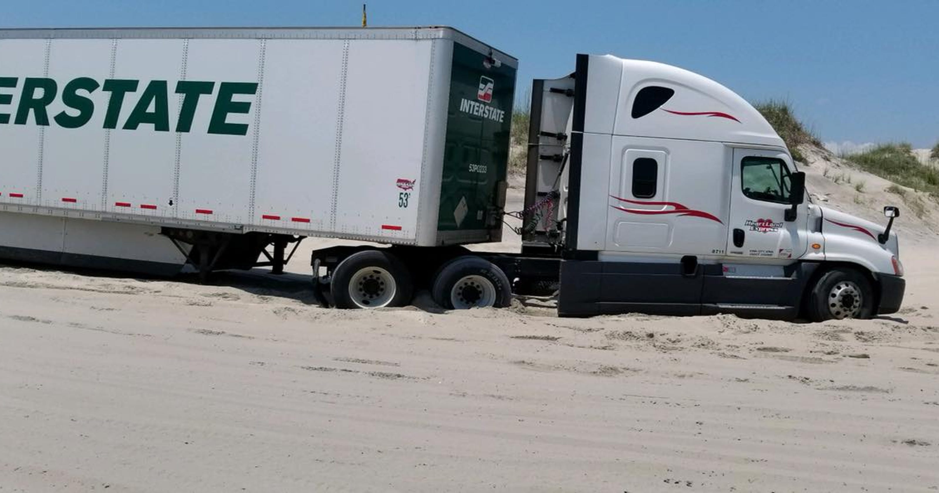 Tractor-trailer gets stuck in Outer Banks trying to drive on beach