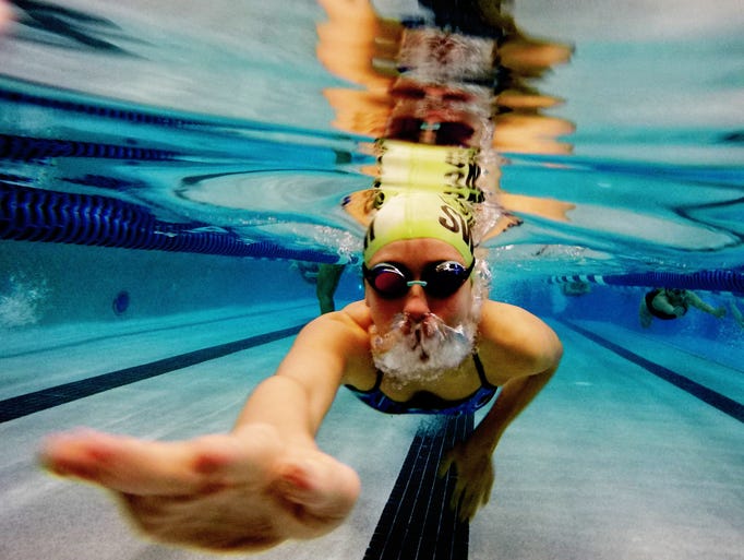 Olympic medalists teach kids their swimming secrets
