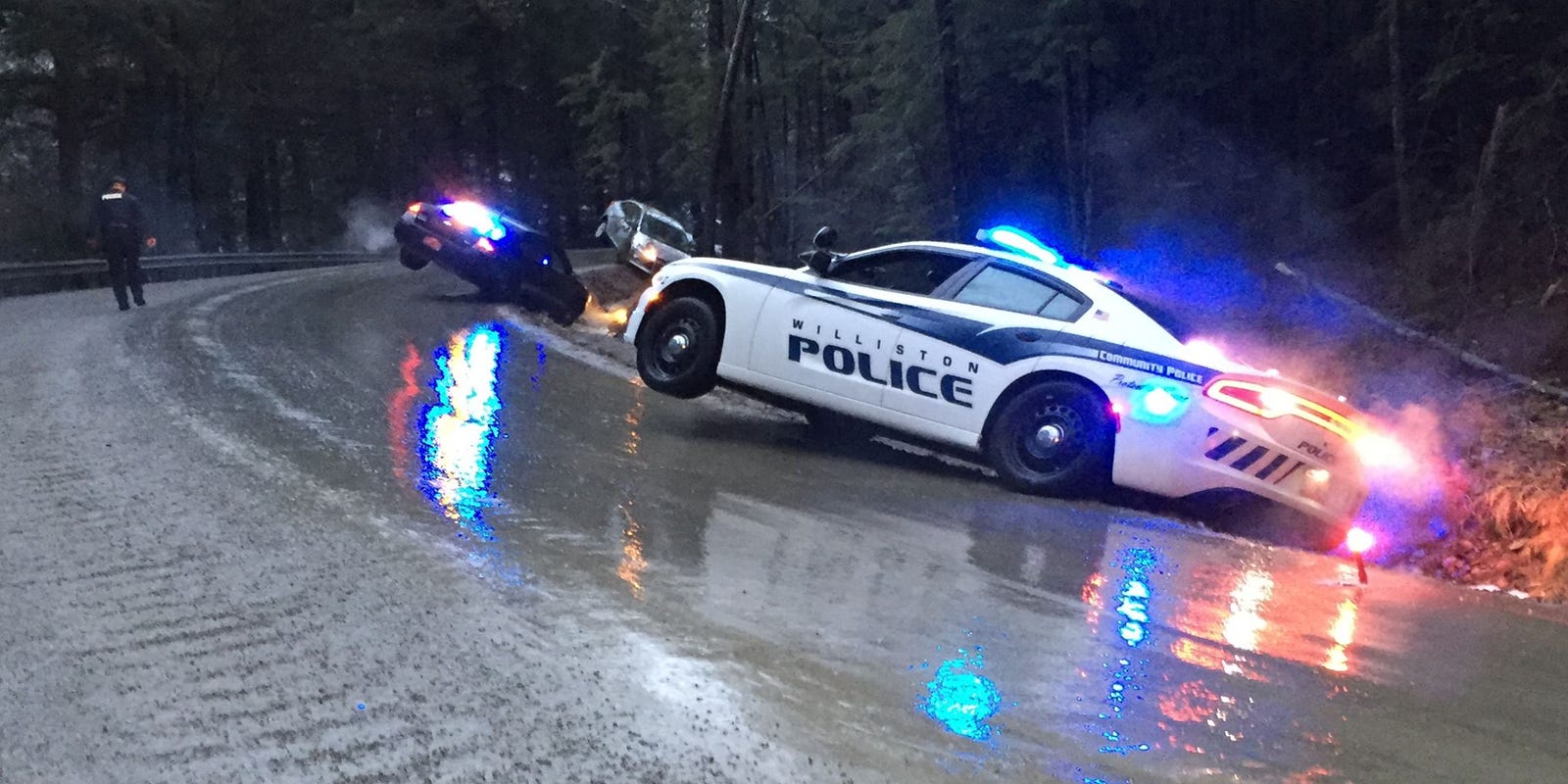 Video shows police SUV slide on ice into woods