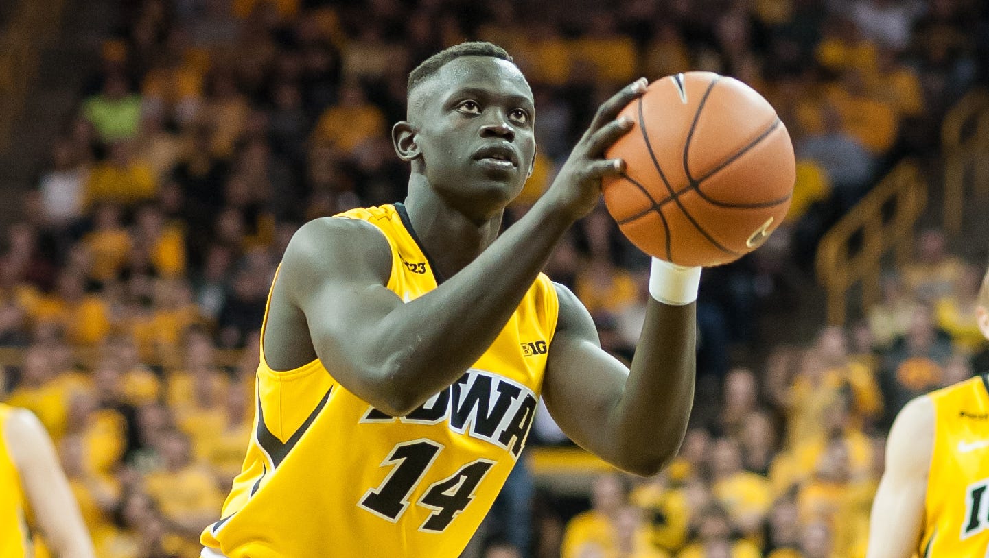 Peter Jok's extraordinary upbringing makes Iowa leadership role come ...