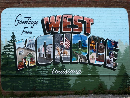 'Wish you were here'! Artists paint postcard-style murals in the Twin ...