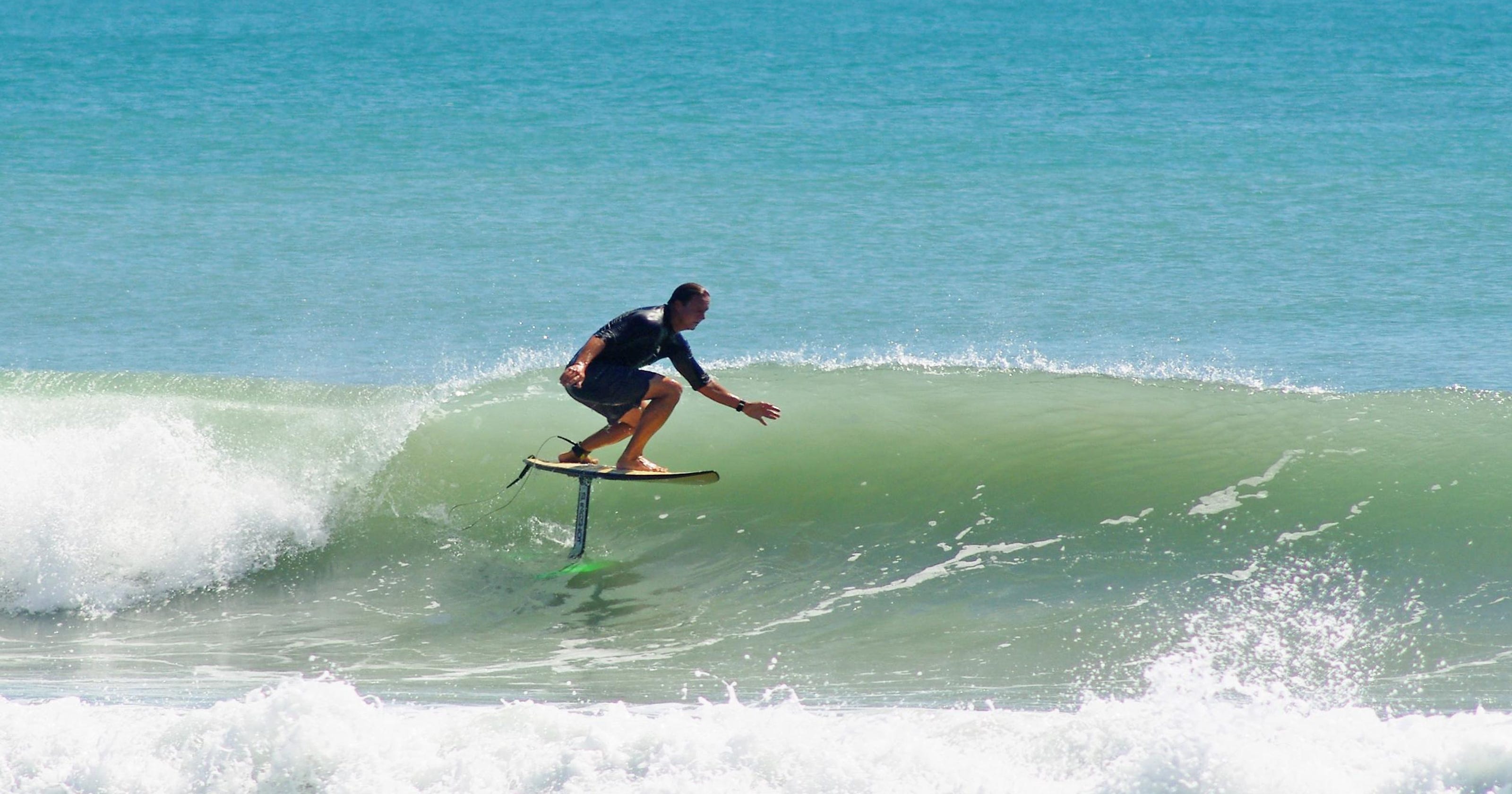 Surfer levitates over Cocoa Beach waves