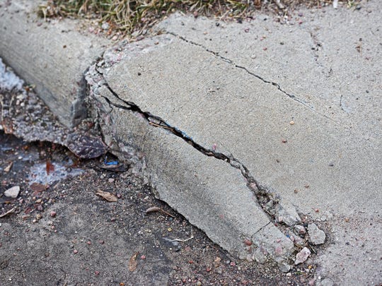 Who pays for a plow-damaged curb?