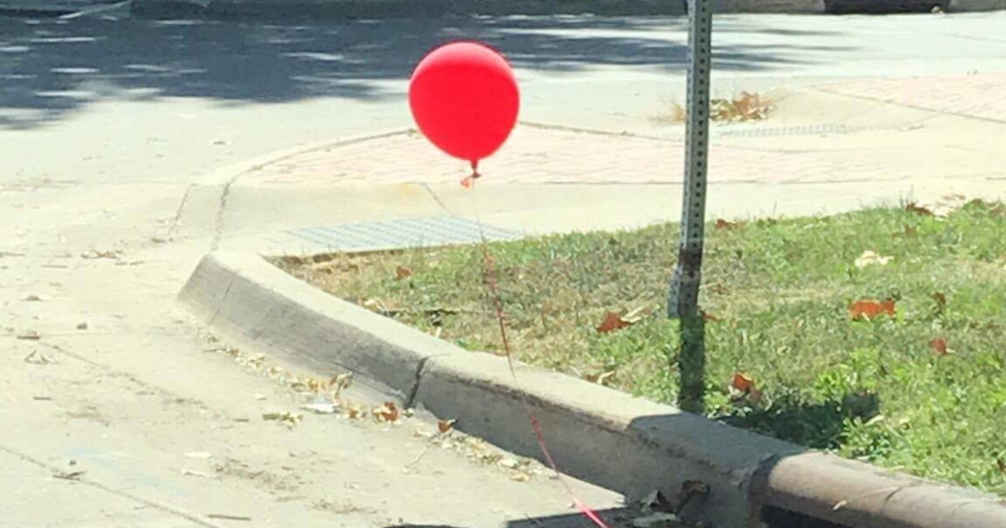 'It'-inspired red balloon tied to Des Moines sewer grate