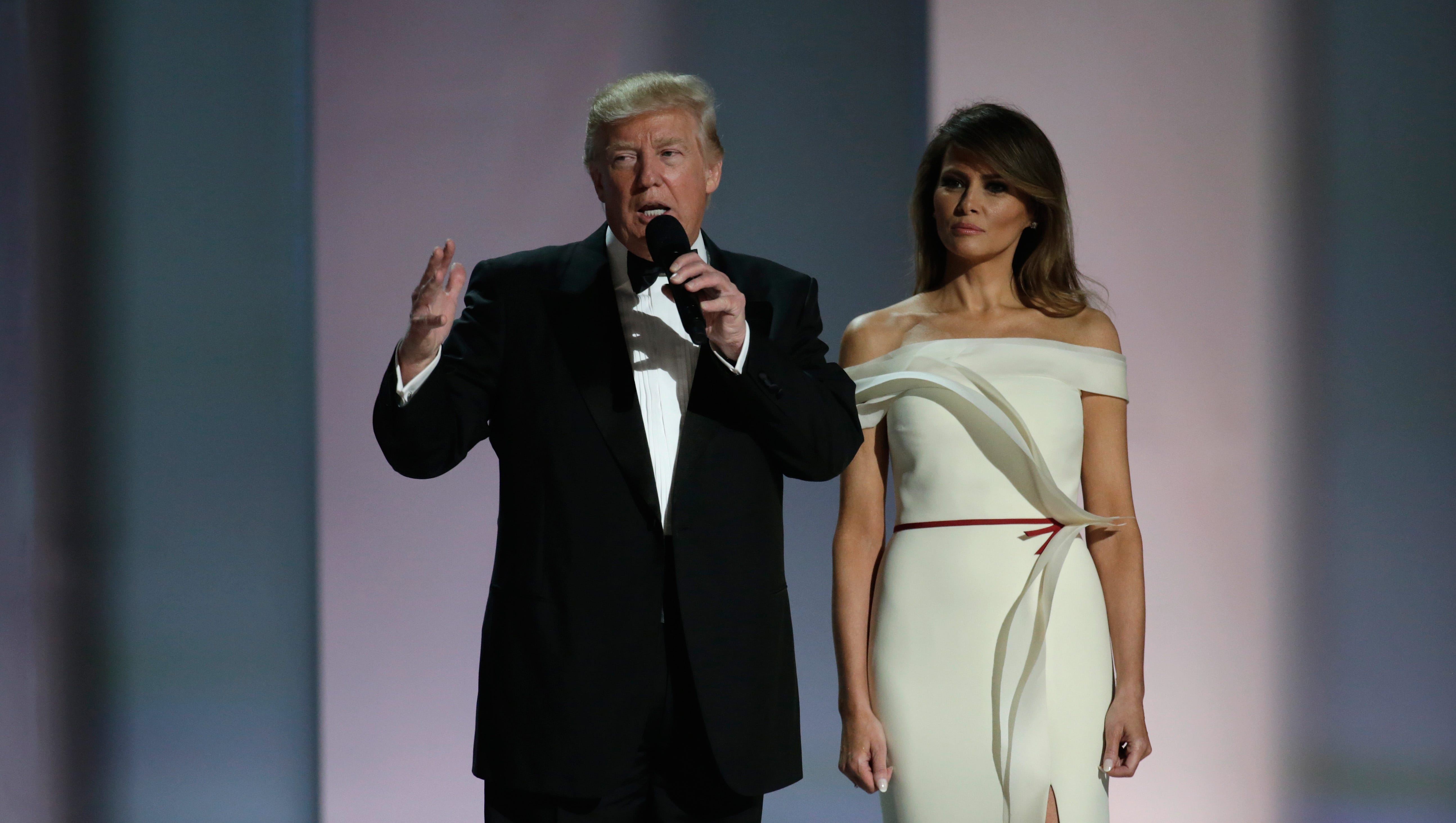 Trumps end night with cheers from crowds at lackluster balls