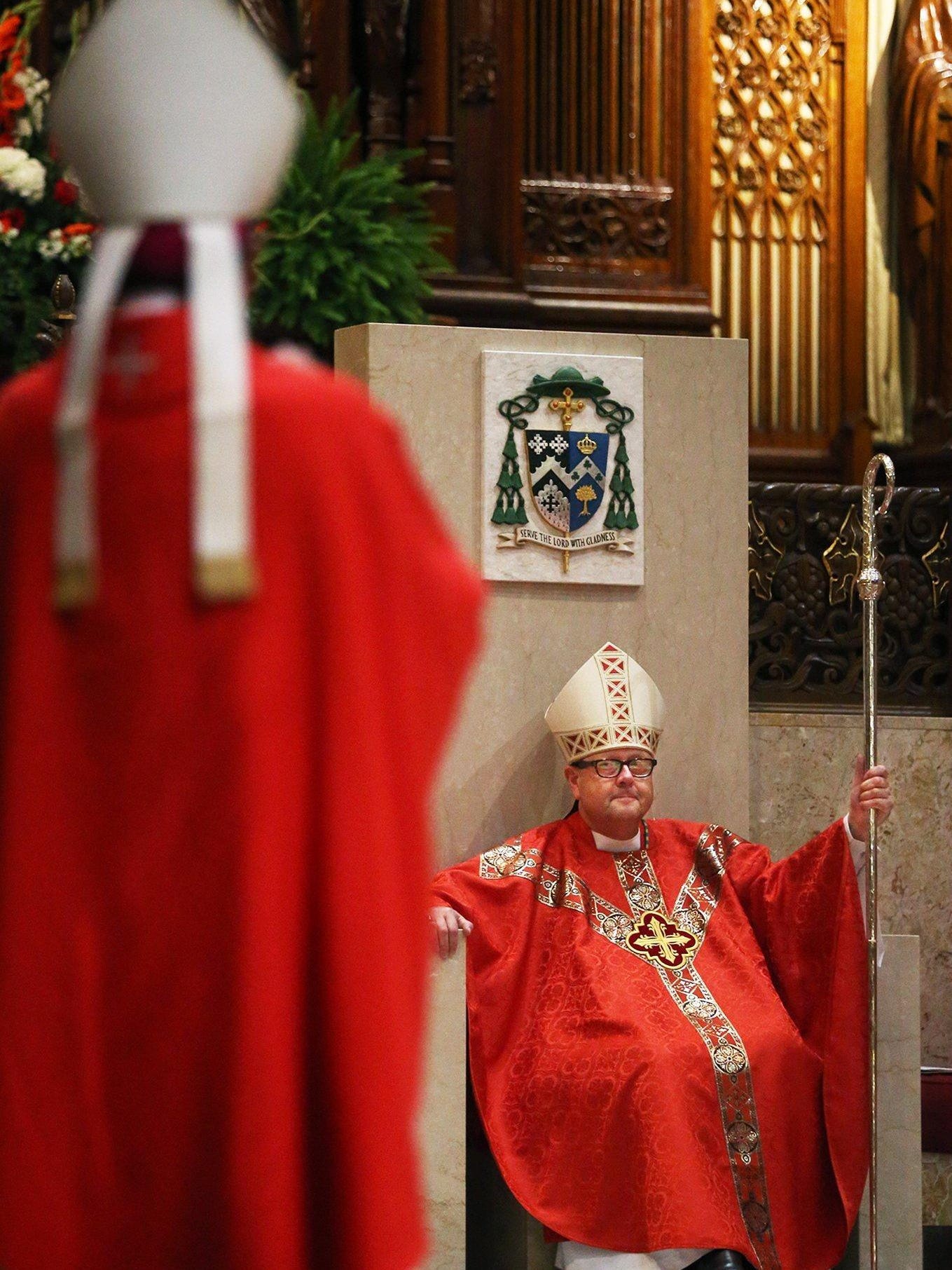 Mask-wearing bishops, priests greet Northeast Ohio's new Catholic ...