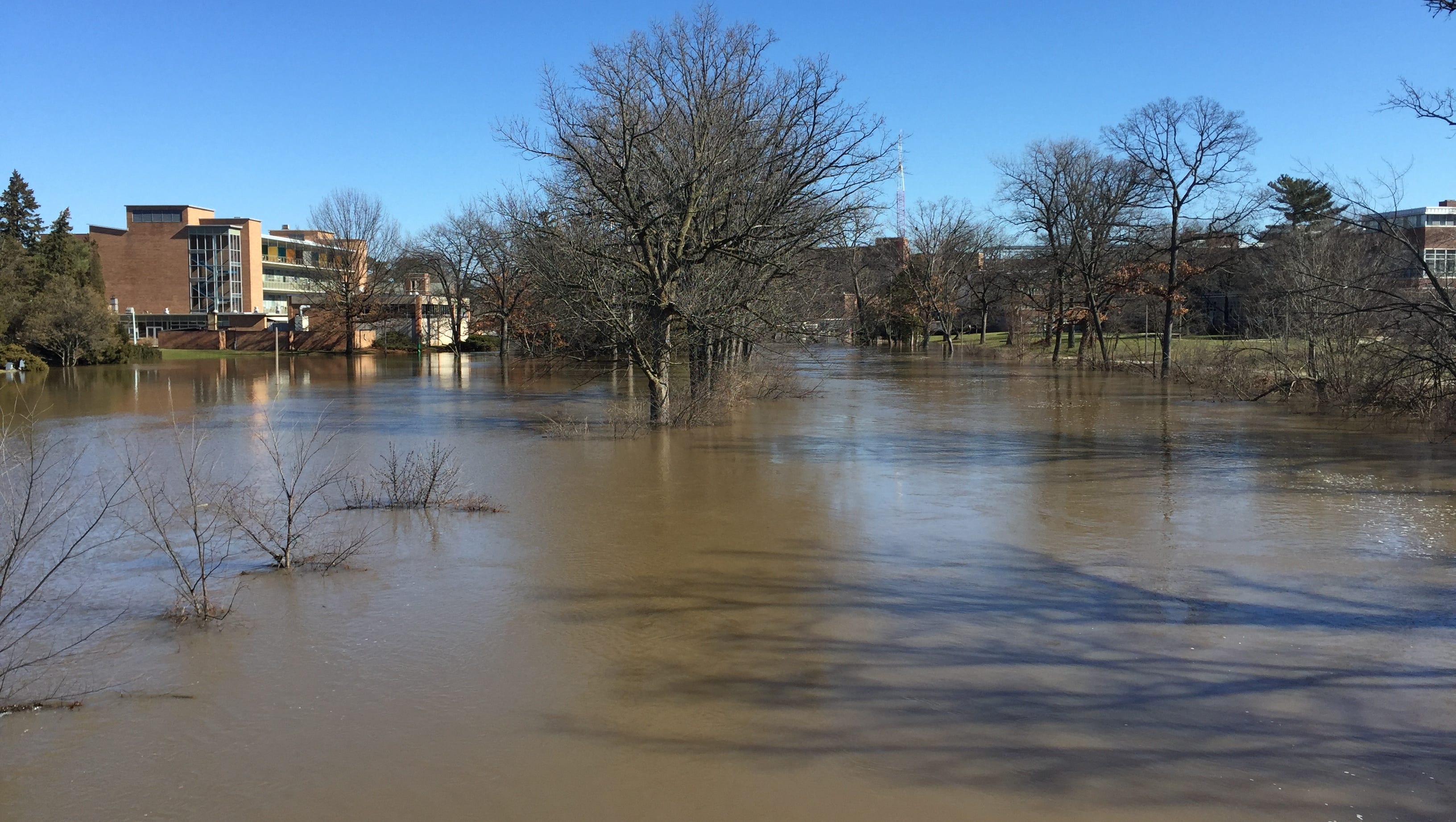 Portions of MSU's campus along Red Cedar River are underwater