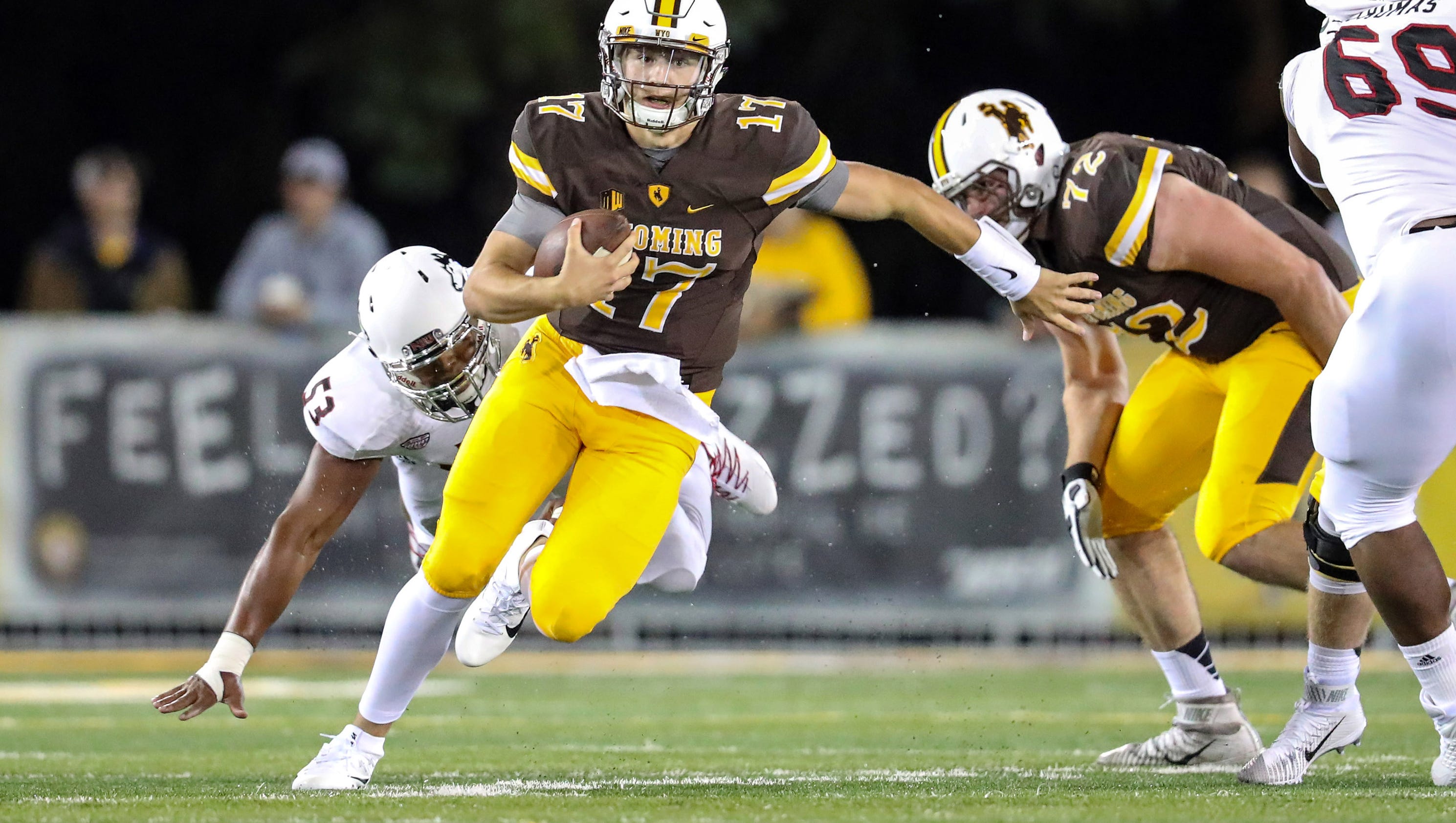 Inside the game: Wyoming QB Josh Allen naked and famous