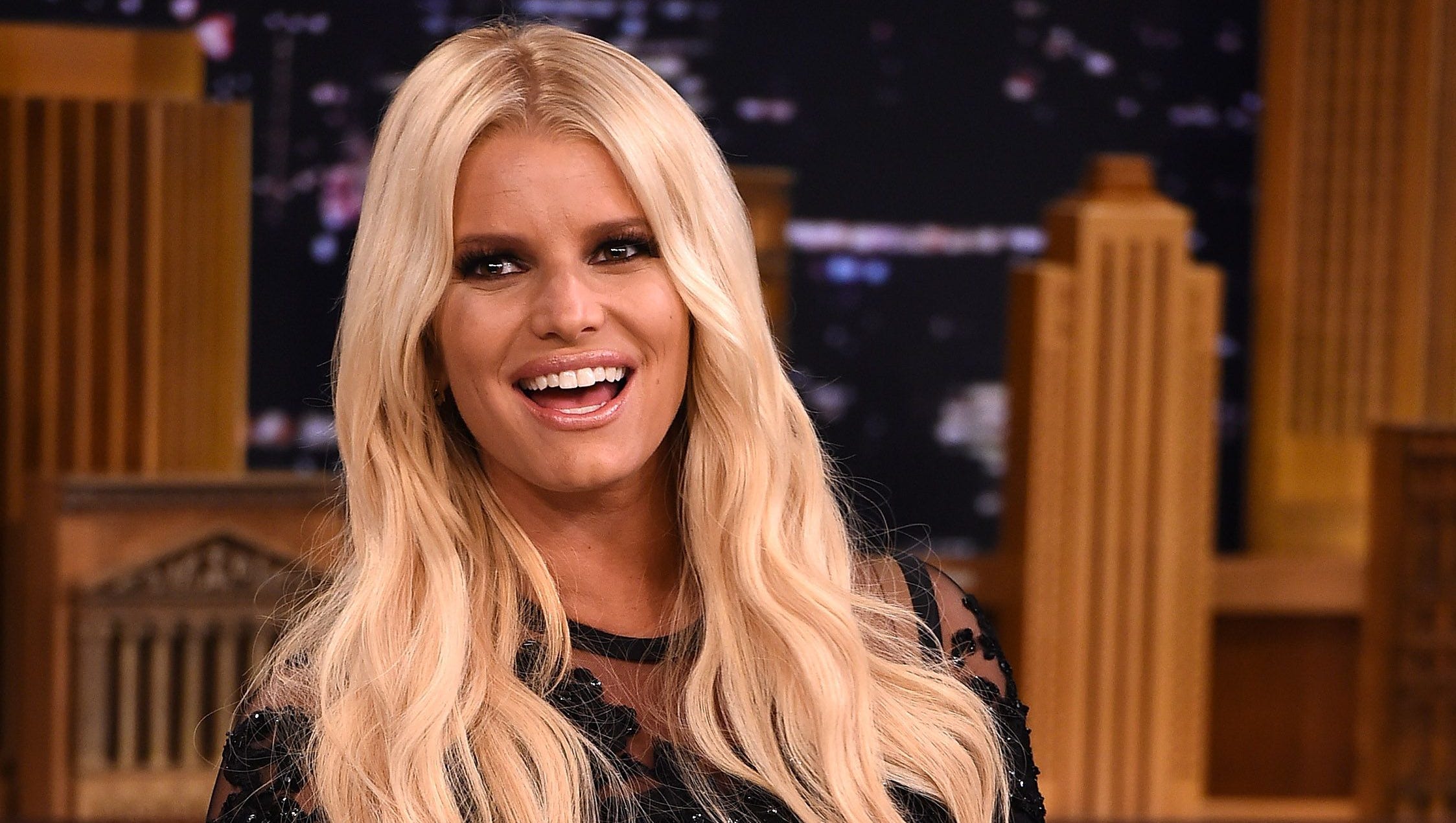 Jessica Simpson marks birthday with topless pool photo