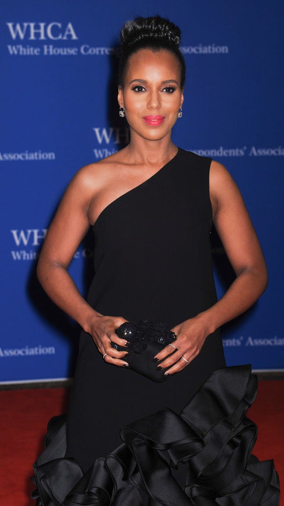 Kerry Washington cradled her tiny baby bump on the Met Gala red carpet