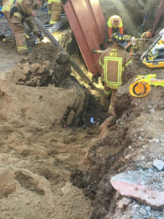 Trench collapse traps 2 workers in Macomb County