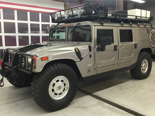 See what 12 cool cars sold for at Barrett-Jackson Wednesday