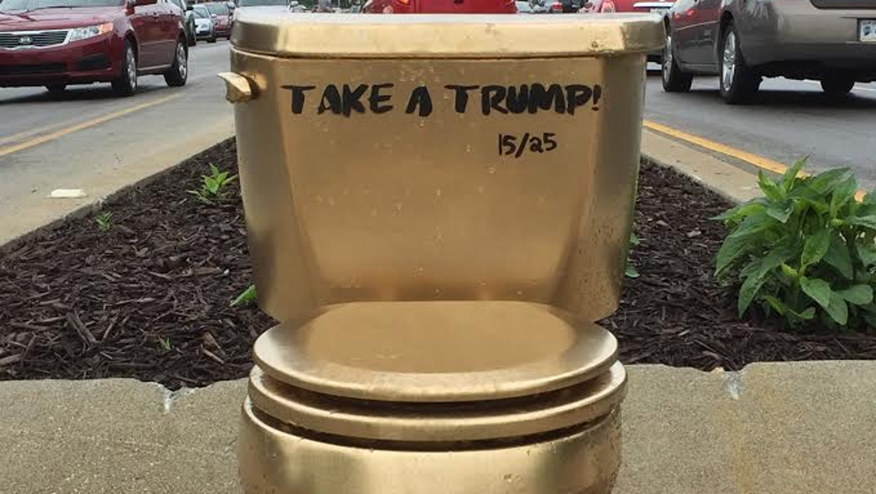 Here's what those golden 'Take a Trump' toilets mean