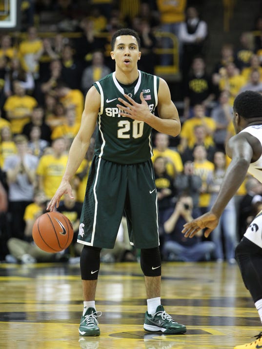 Iowa program's banes remain in latest loss to Michigan St.