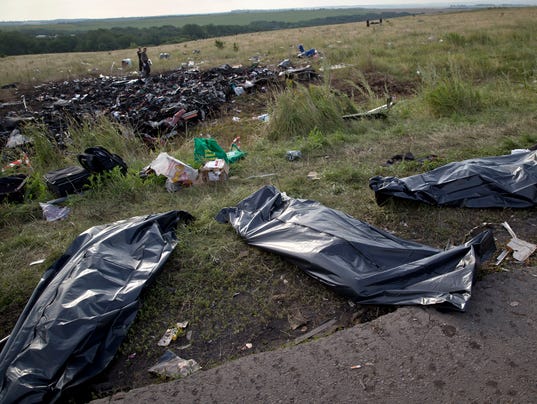 Ukraine, rebels agree on security zone at crash site