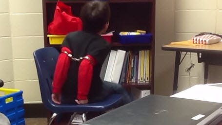Video shows disabled boy, 8, handcuffed in chair at school
