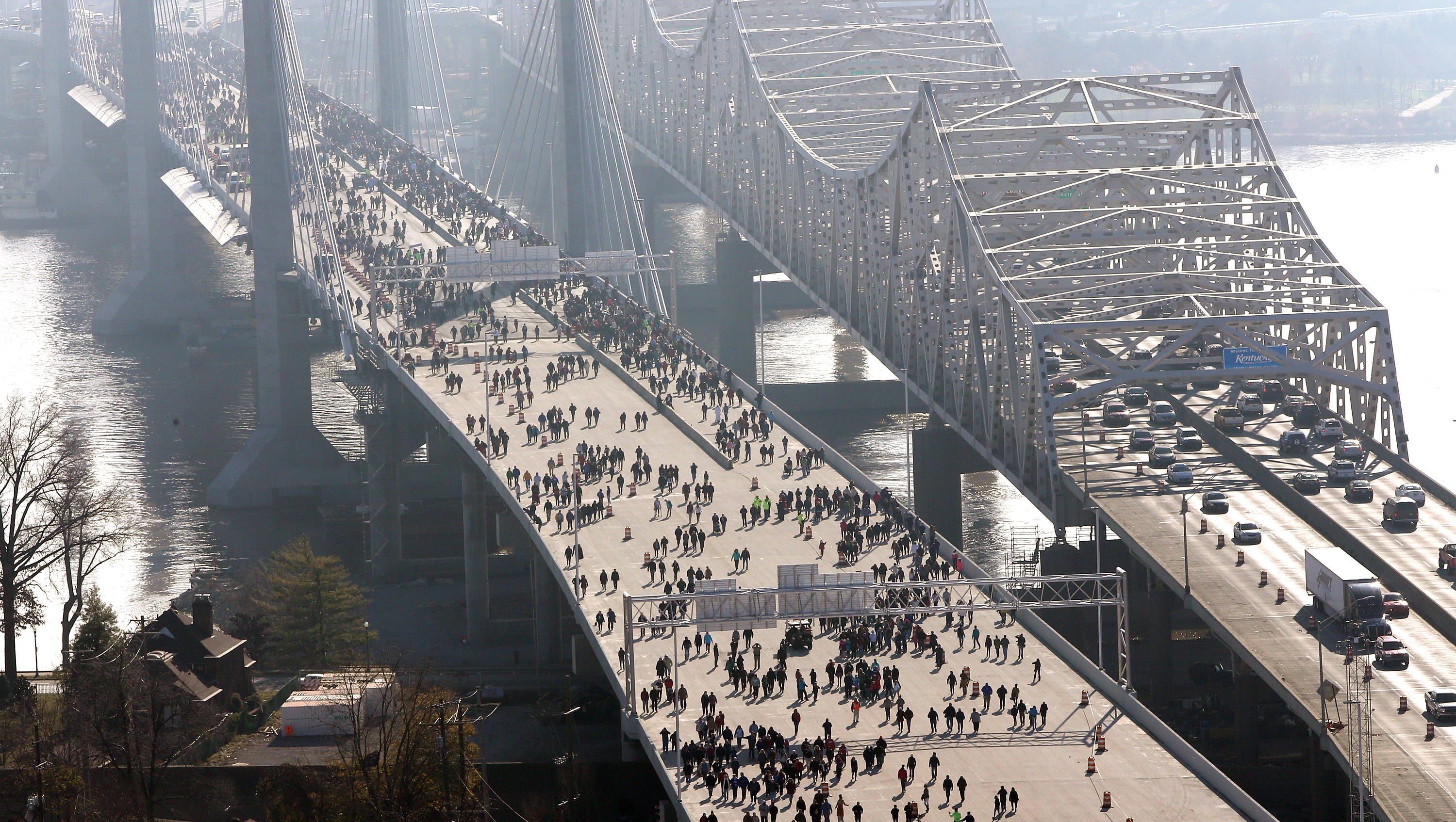 Large crowd braves chill to walk new Abraham Lincoln Bridge in Louisville