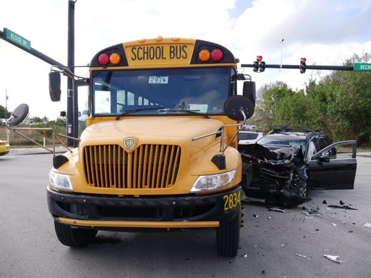 Car runs red light, t-bones school bus in Port St. Lucie