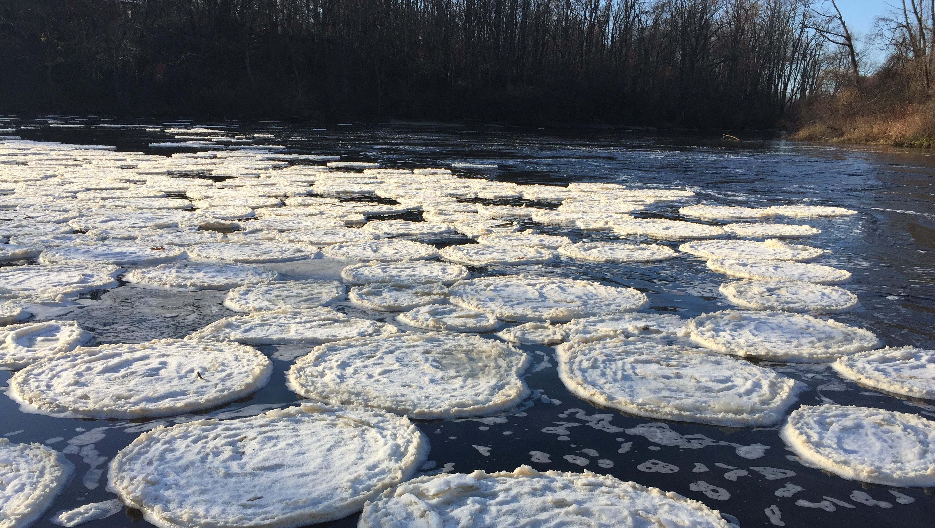 Spinning snow and ice circles grace a local waterway