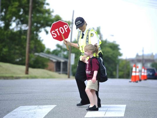 Police looking to hire dozens of school crossing guards