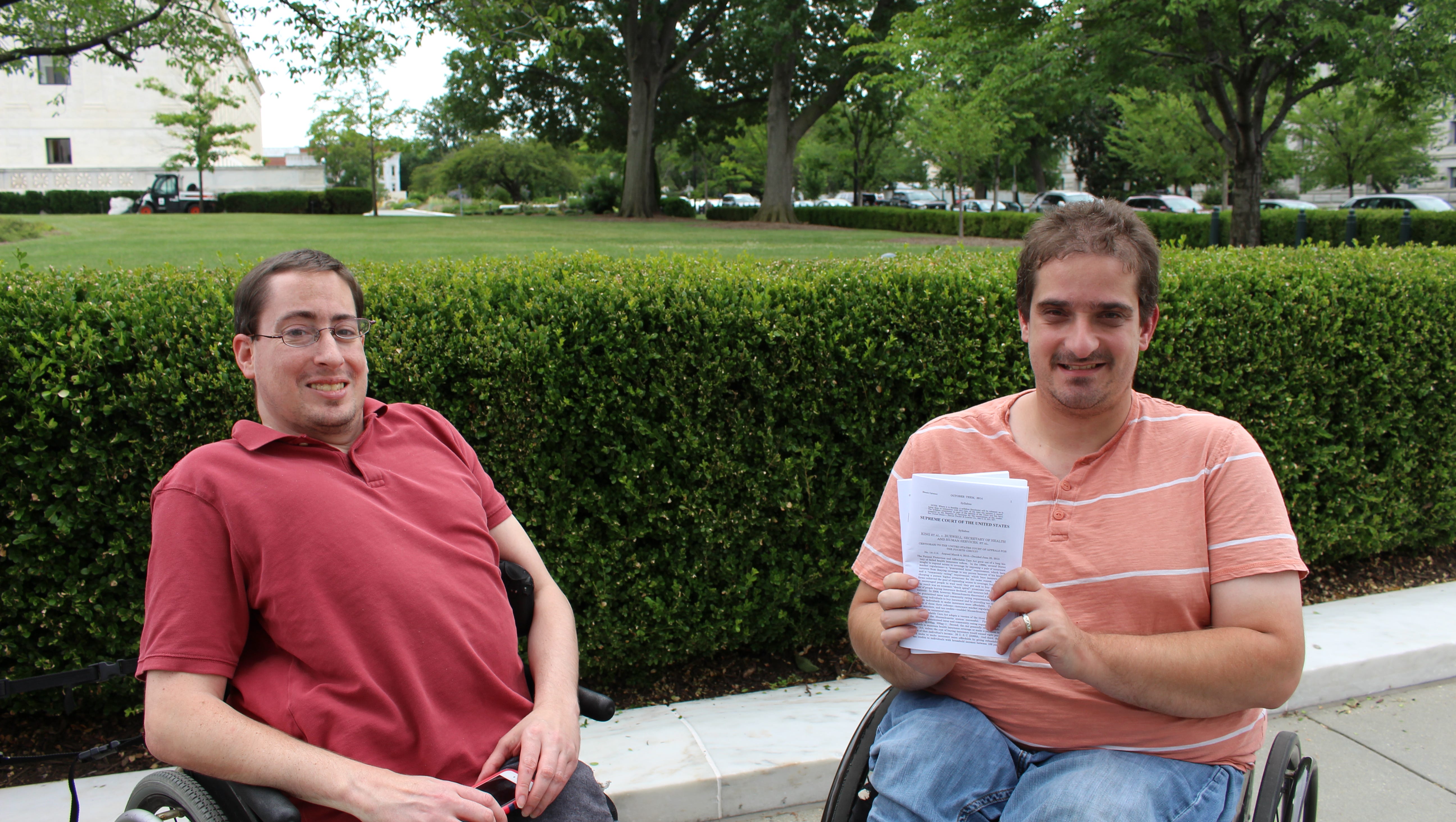 Justin Chappell (left) and Ben Spangenberg hold up the decision from ...