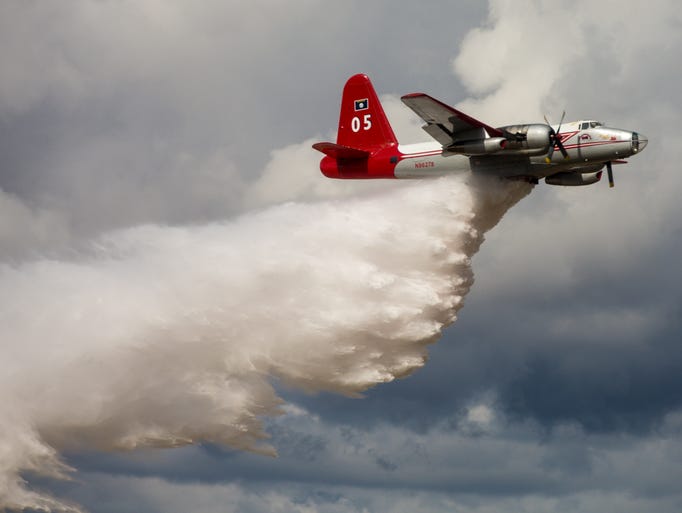 P-2 Neptune, fire-fighting juggernaut, flies into the sunset