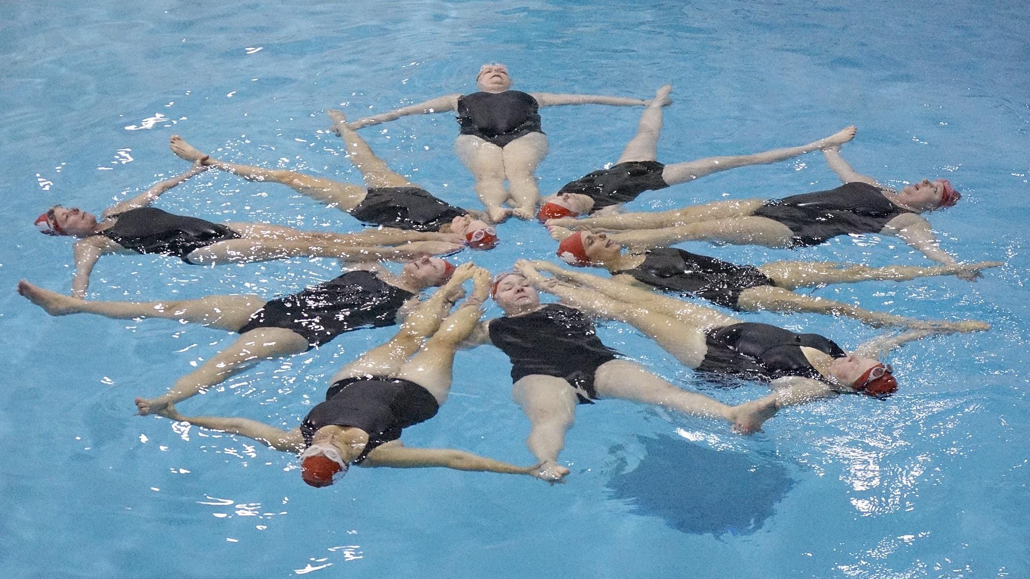 Synchronized swimmers show off dance, gymnastics moves