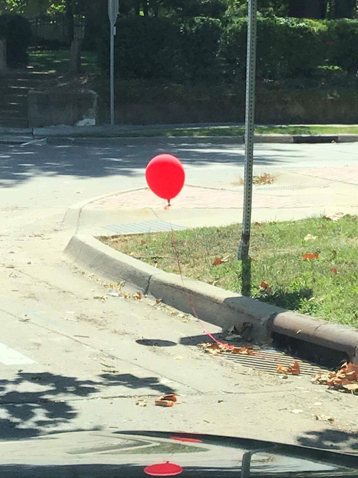 'It'-inspired red balloon tied to Des Moines sewer grate