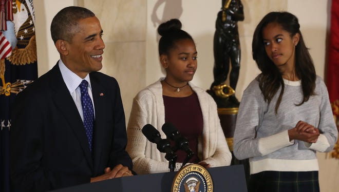 President Obama Speaks As His Daughters Sasha Left And Malia Look