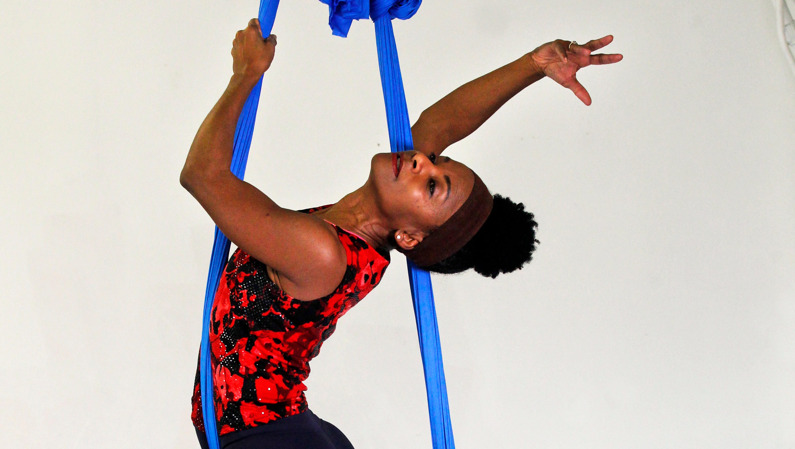 Aerial yoga is a high-flying - and strength-building - fitness trend