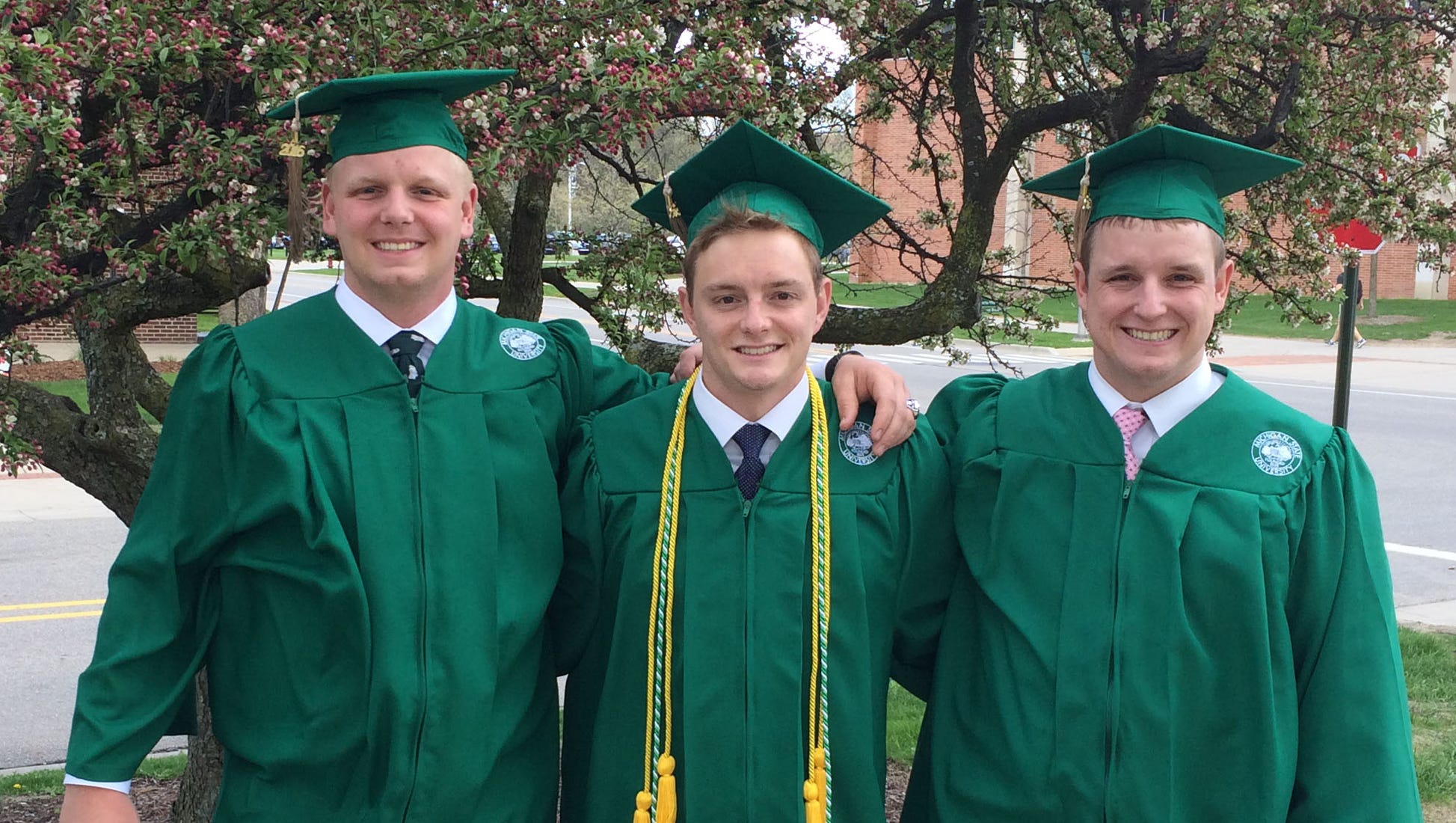 Triplets carry on family tradition with degrees from MSU