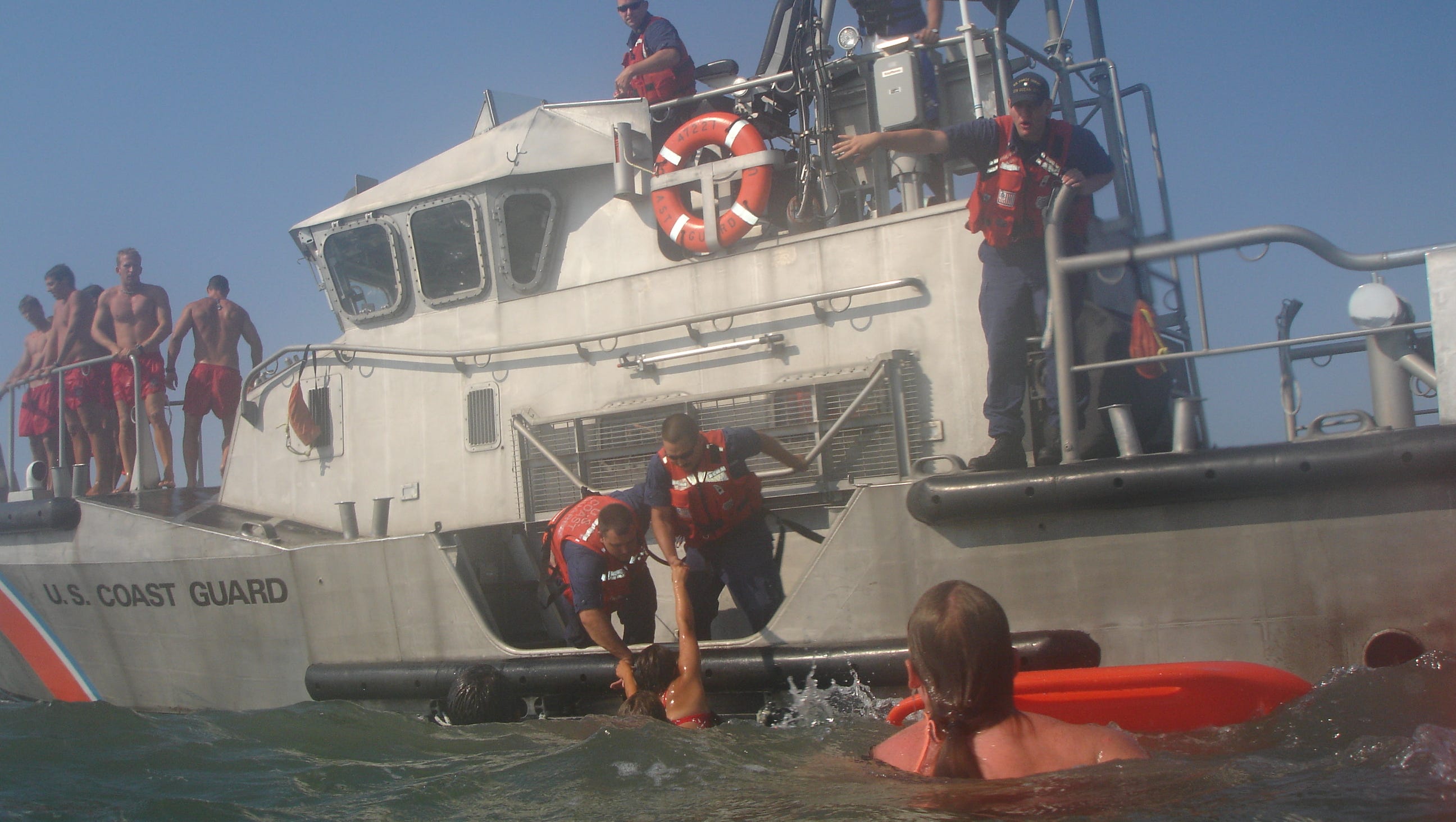Coast Guard, beach patrol rescue person from rip current