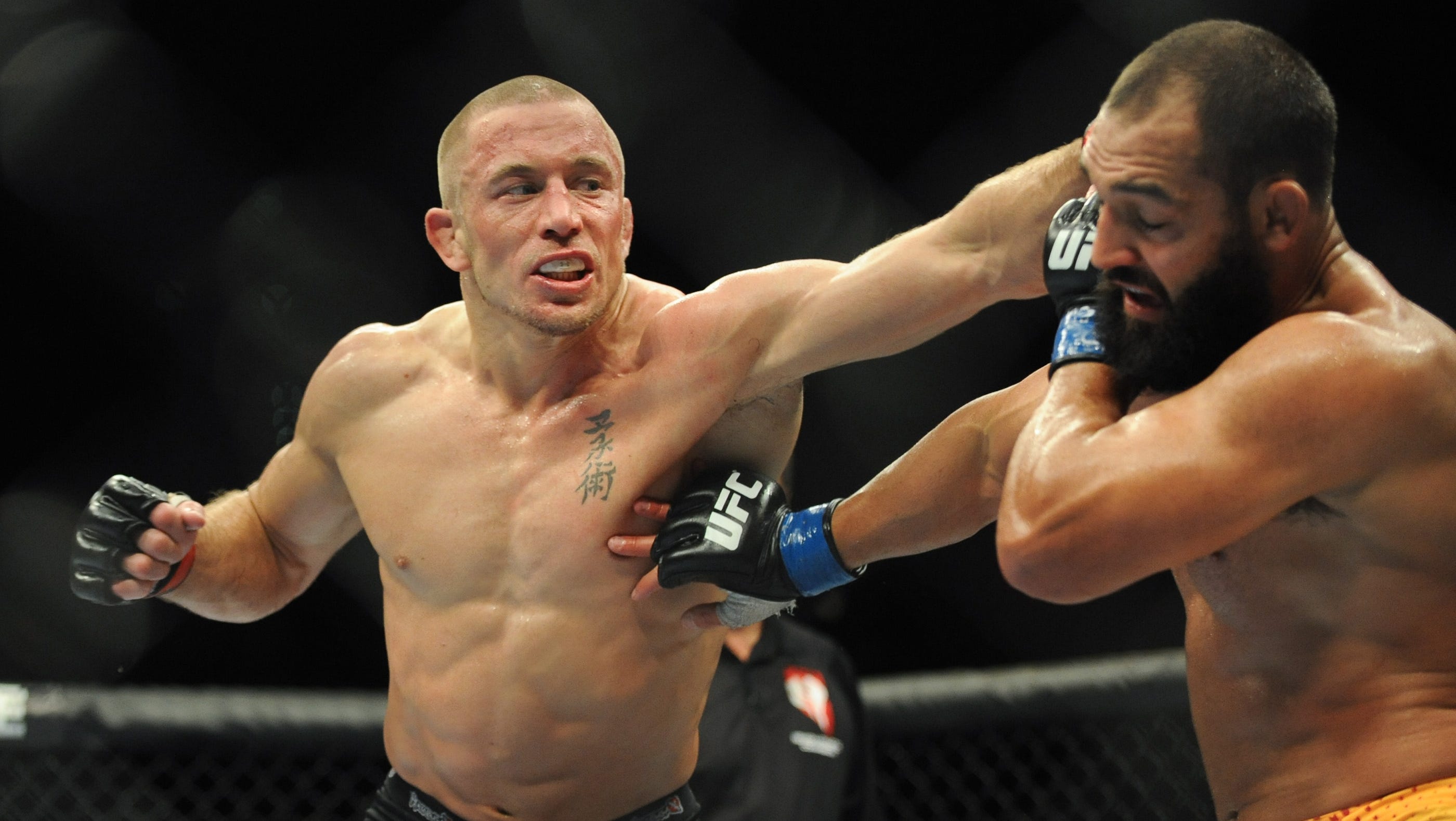 St-Pierre wins by stunning split decision over Hendricks