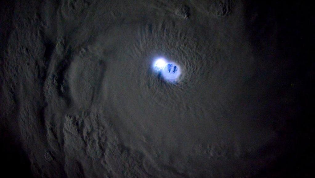 Lightning illuminates the center of Cyclone Bansi last week.