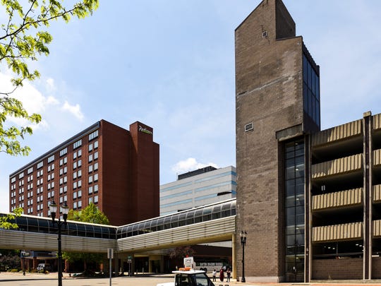 Company sues Lansing over parking spots for downtown Radisson Hotel